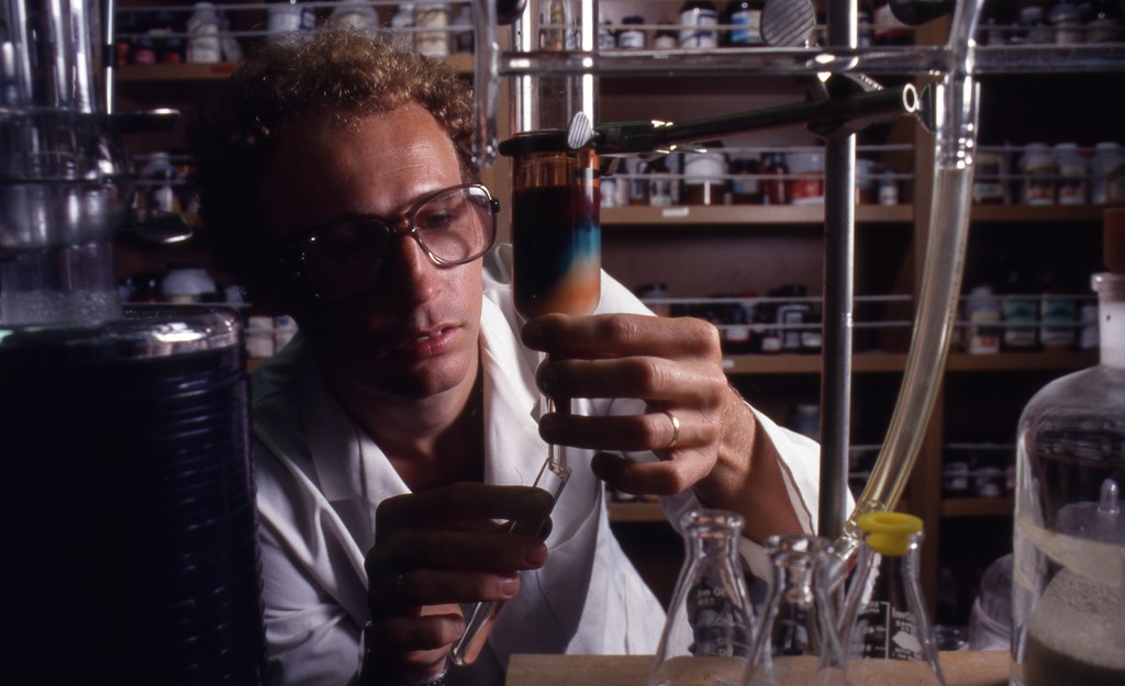 Unidentified professor in science lab, conducting an experiment ...