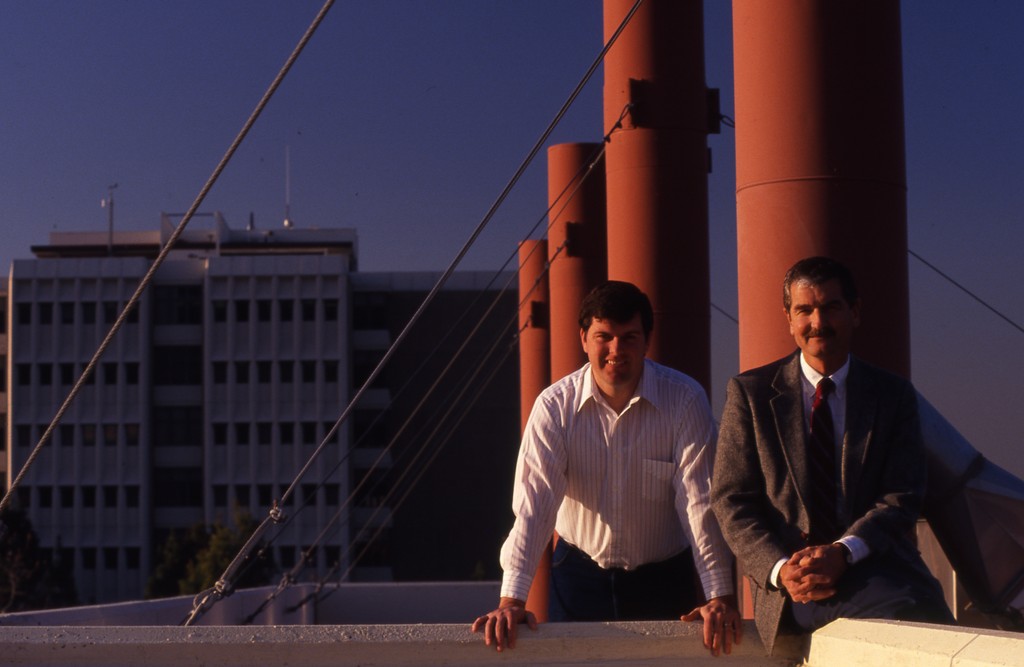 Two unidentified faculty members (Samuelson?) posing on a roof top ...