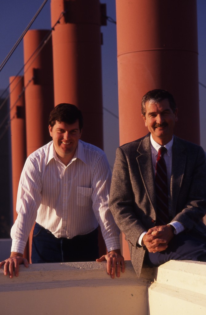 Two unidentified faculty members (Samuelson?) posing on a roof top ...