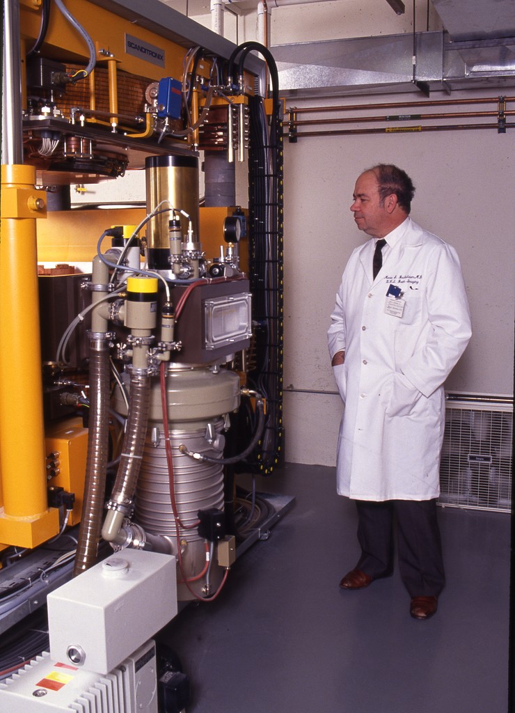 Professor Monte Buchsbaum, B.I.C., with cyclotron. — Calisphere