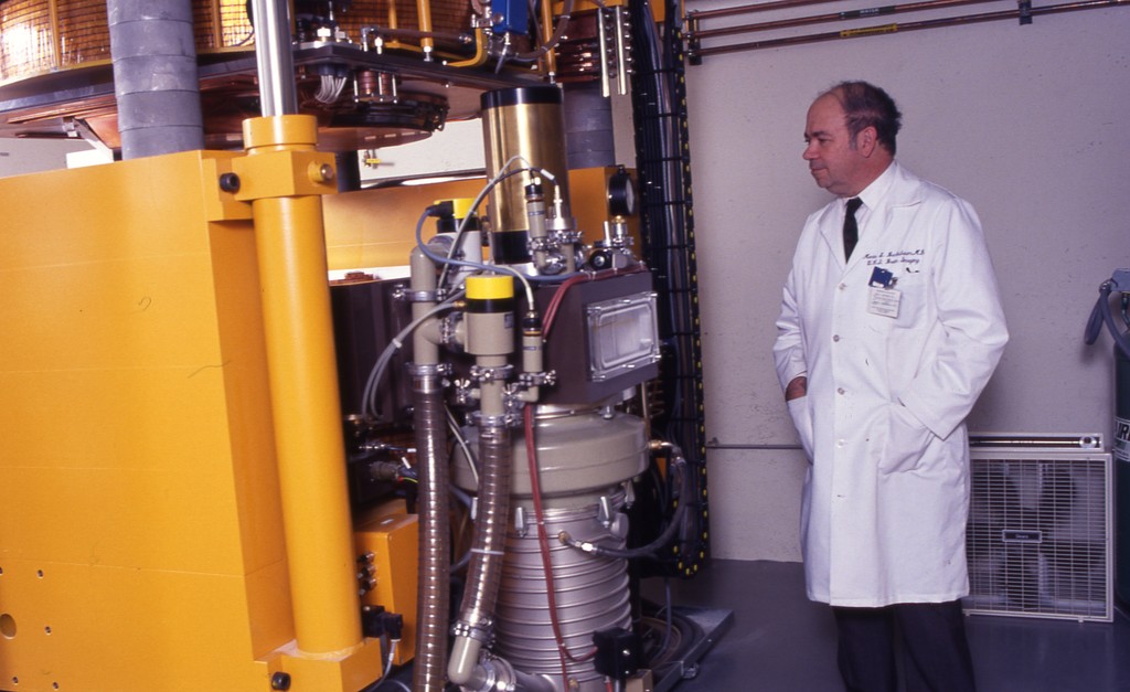 Professor Monte Buchsbaum, B.I.C., with cyclotron. — Calisphere