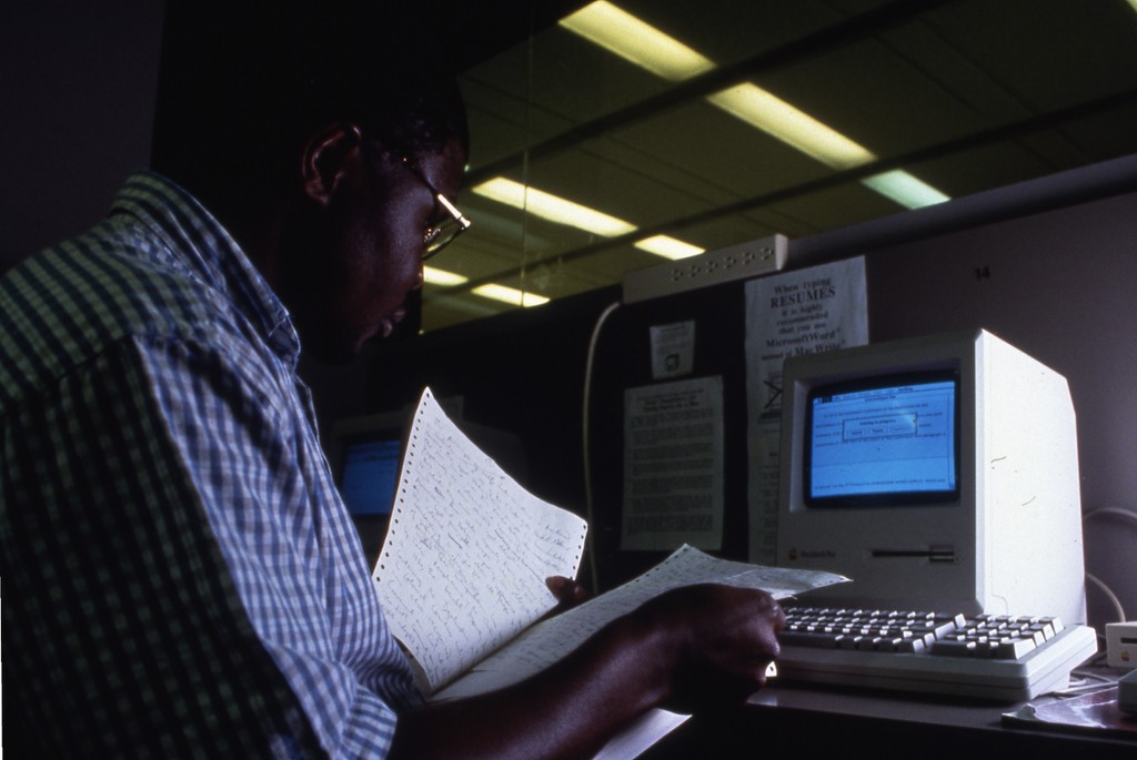 Students and faculty doing research in a science lab. — Calisphere