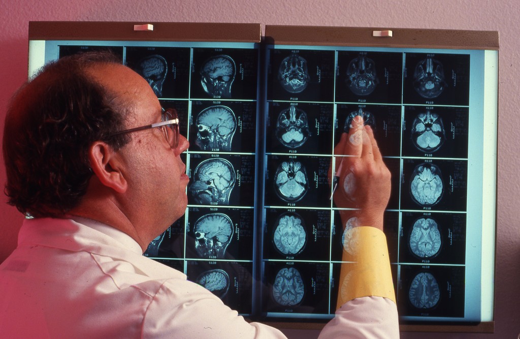 Images for the 1987 Annual report, Dr. Buchsbaum in a science lab, and ...