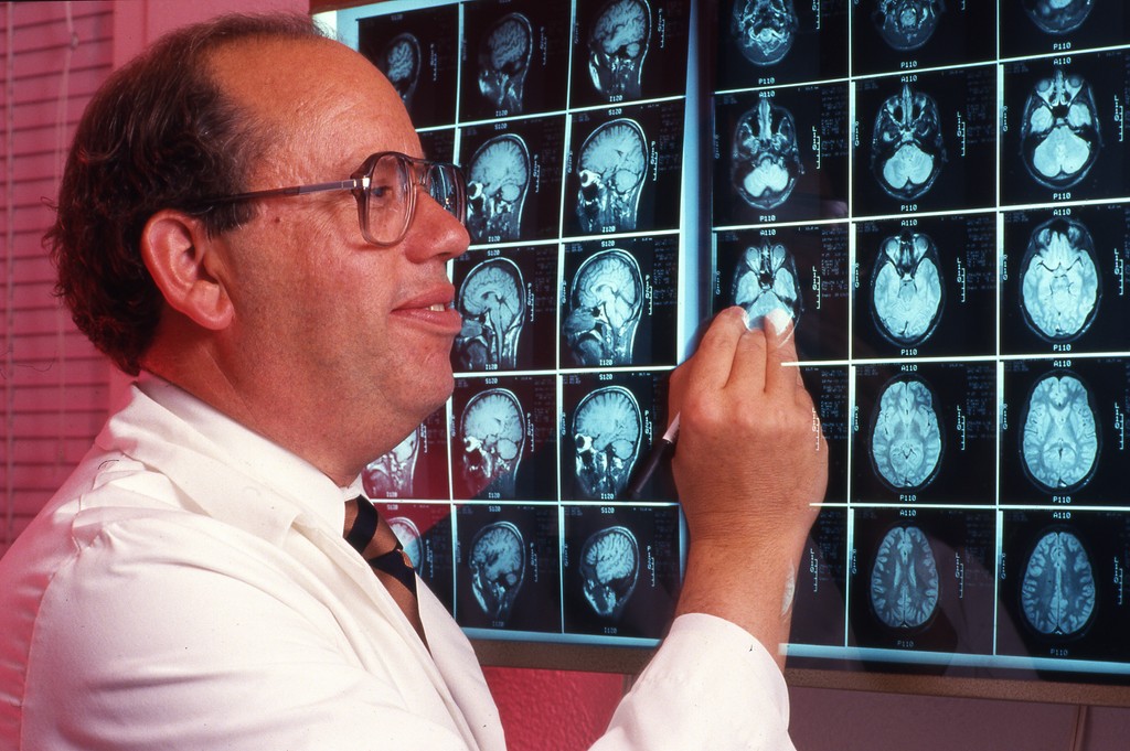 Images for the 1987 Annual report, Dr. Buchsbaum in a science lab, and ...