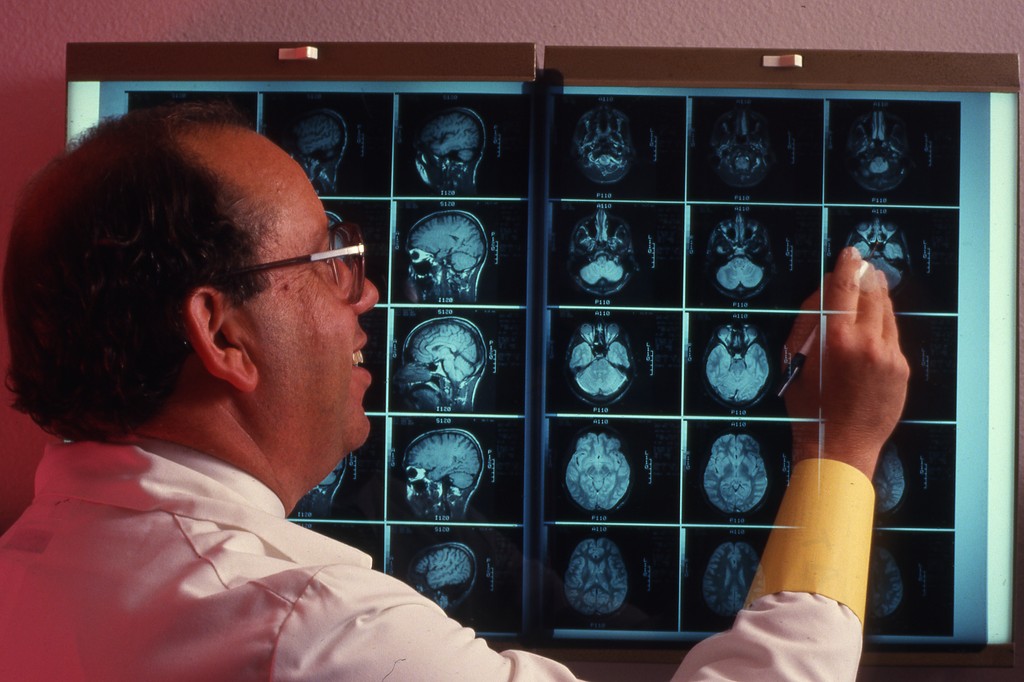 Images for the 1987 Annual report, Dr. Cahan and two unidentified ...