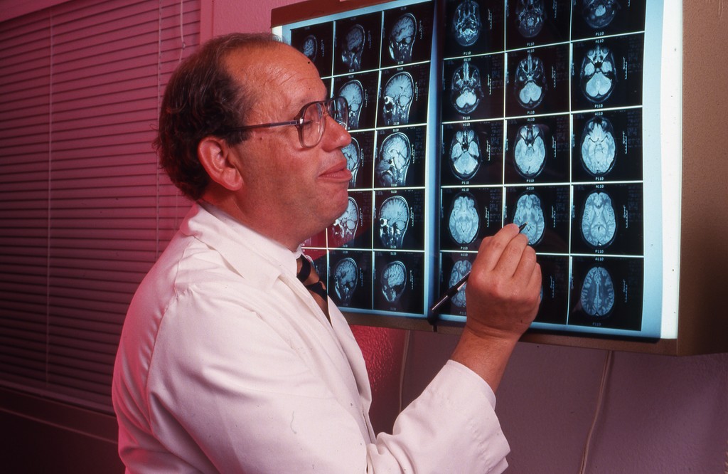 Images for the 1987 Annual report, Dr. Cahan and two unidentified ...