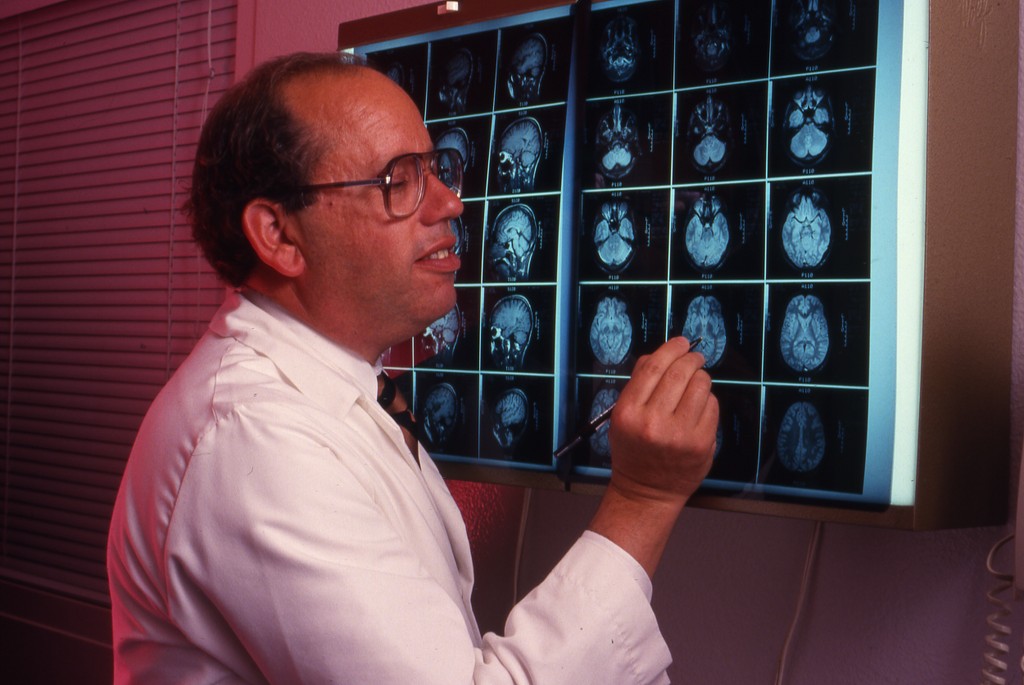 Images for the 1987 Annual report, Dr. Cahan and two unidentified ...