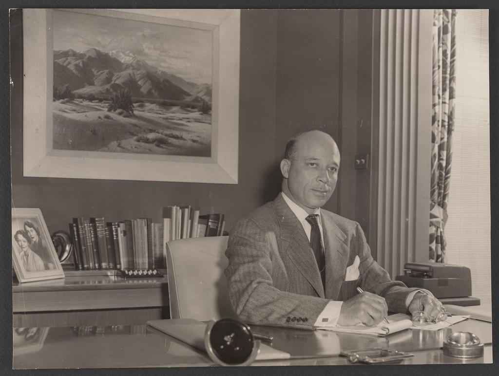 Portrait of Edgar J. Johnson at his desk — Calisphere