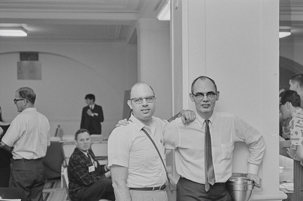 Jay Kay Klein and Frederik Pohl in the hall, Tricon — Calisphere