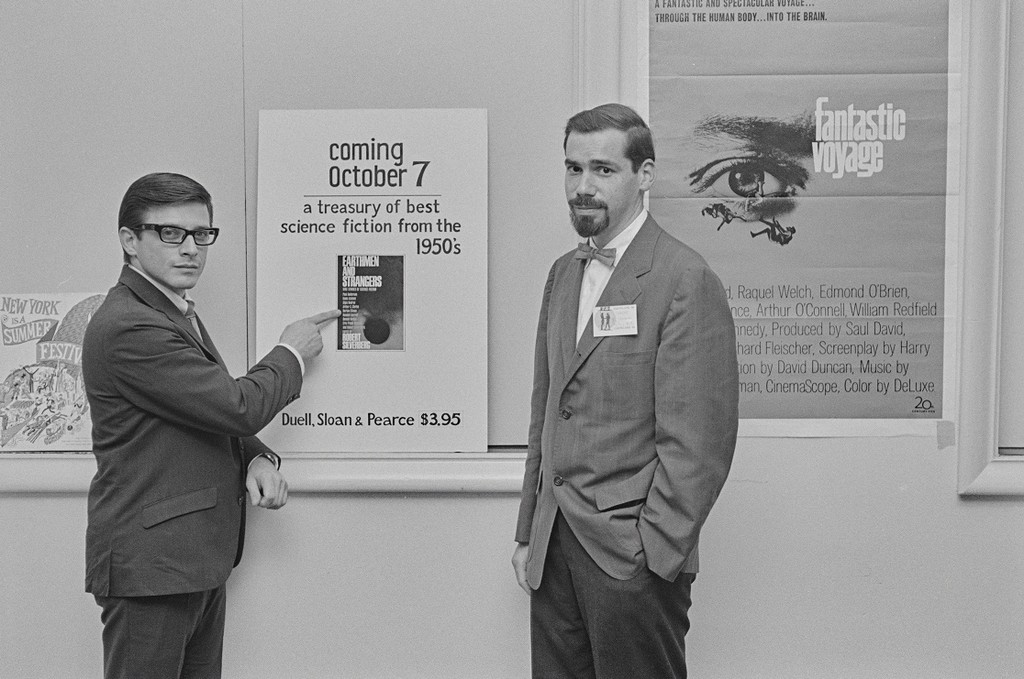 Harlan Ellison and Robert Silverberg in front of posters, Tricon ...