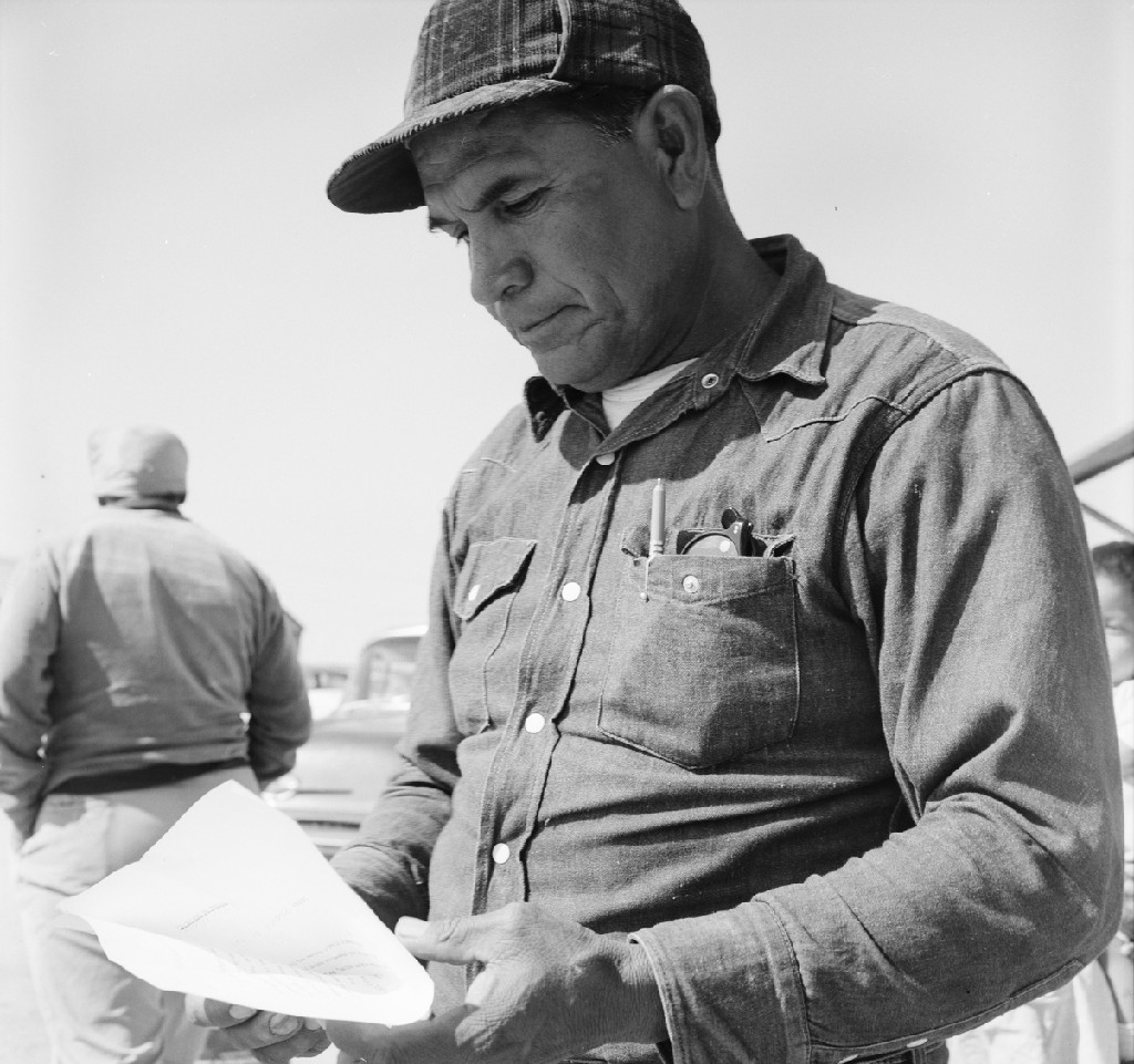 Man reading paper — Calisphere