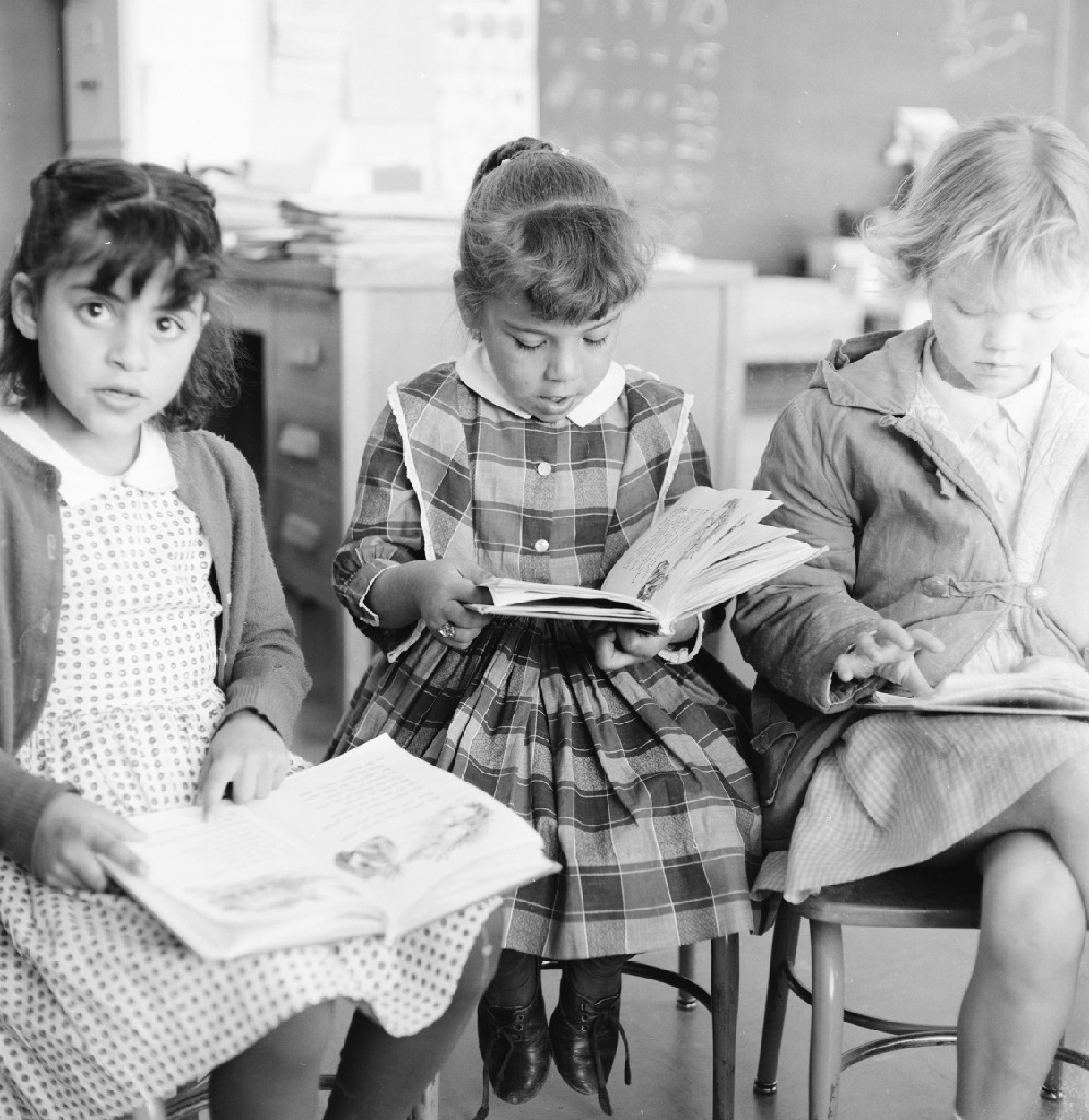 Farmworkers' daughters reading in school — Calisphere