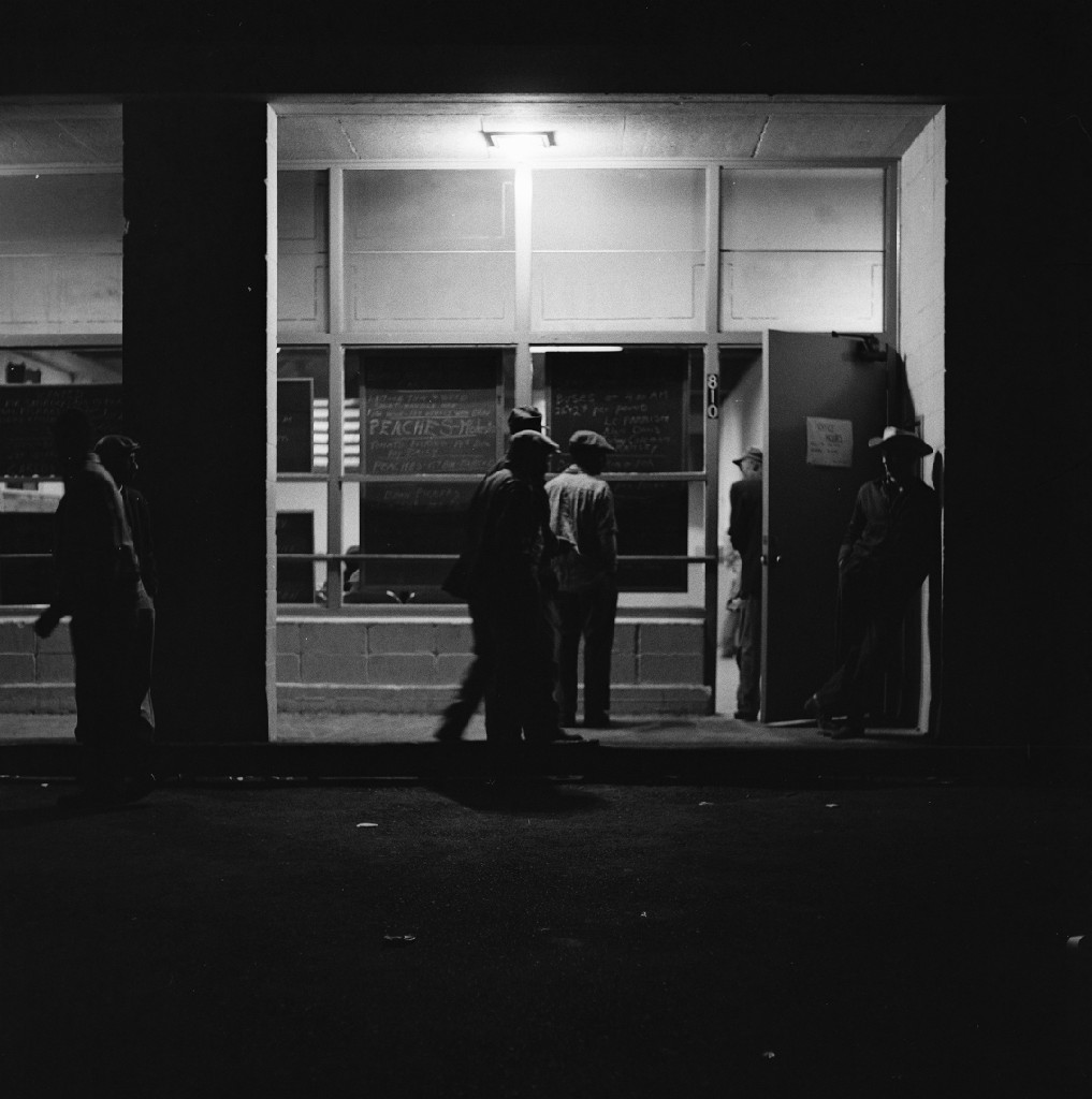 Farmworkers entering labor office before dawn — Calisphere