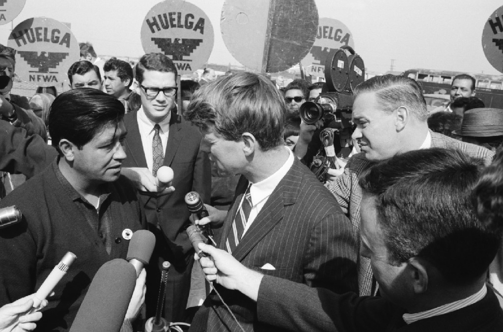 Cesar Chavez & Senator Bobby Kennedy talking in the crowd — Calisphere