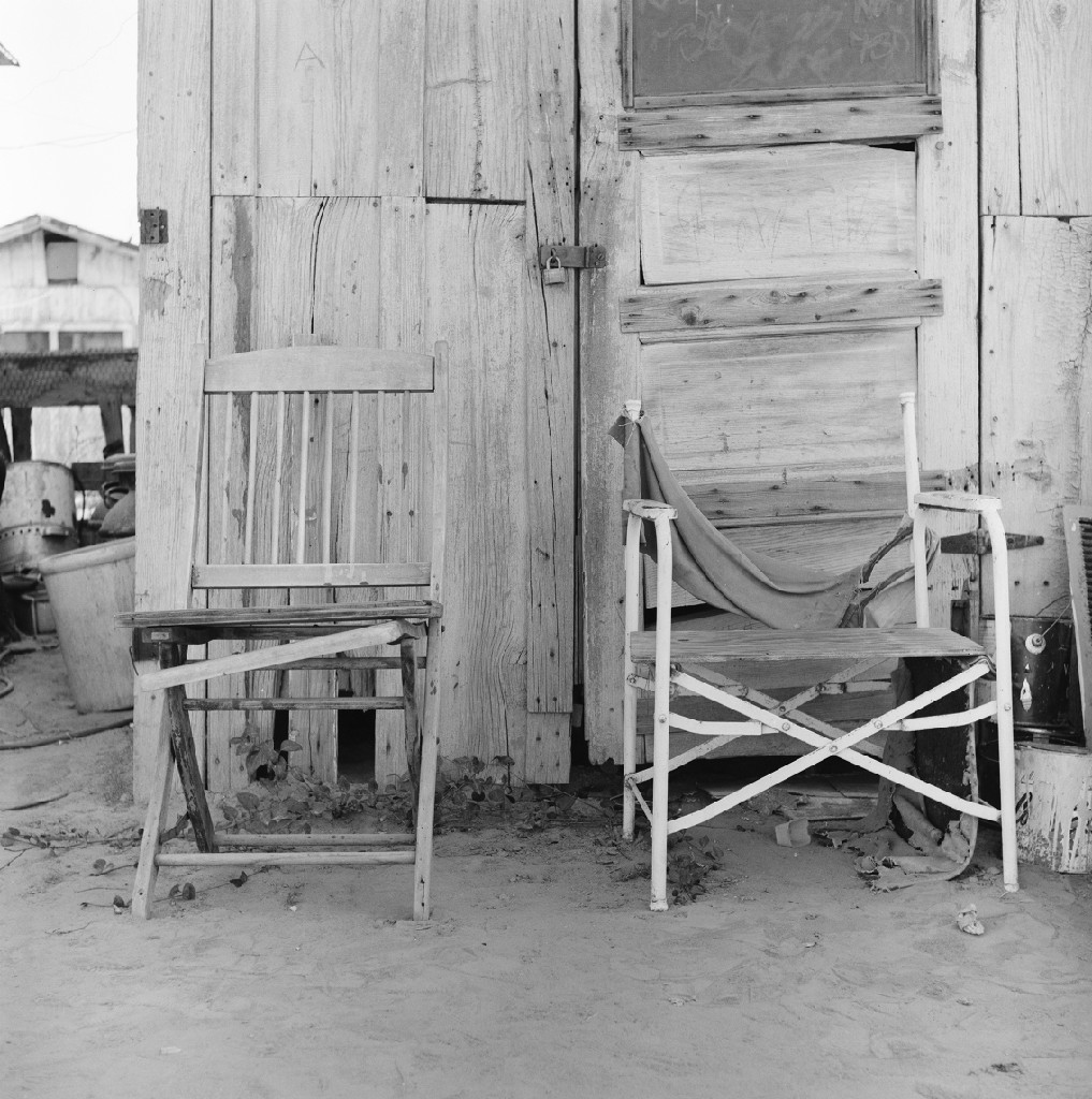 Rickety chairs sitting outside shack — Calisphere