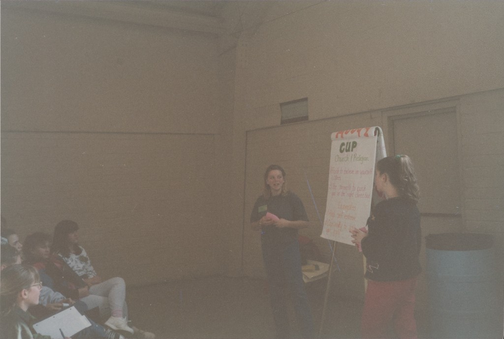 [Two girls present on church and religion] — Calisphere