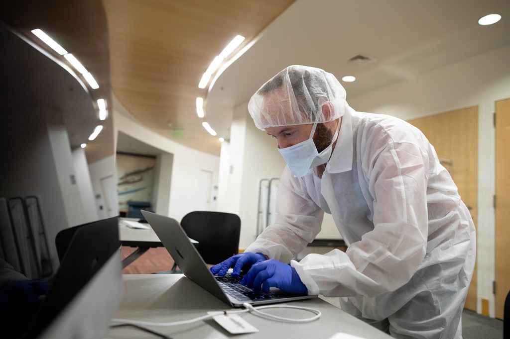Dylan Romero Working on Computer in Production Area Photo By Susan ...