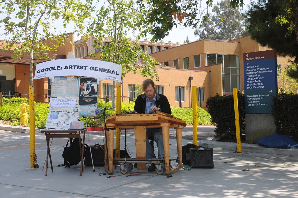Michael Masley playing a cimbalom on the Ring Mall; photograph at ...