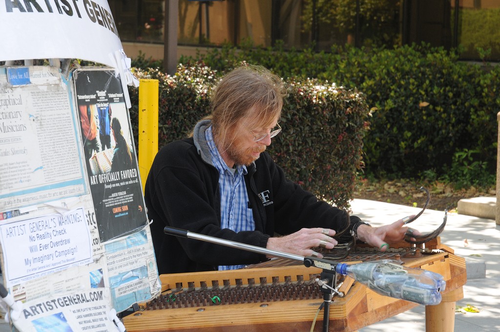 Michael Masley playing a cimbalom on the Ring Mall; photograph at ...