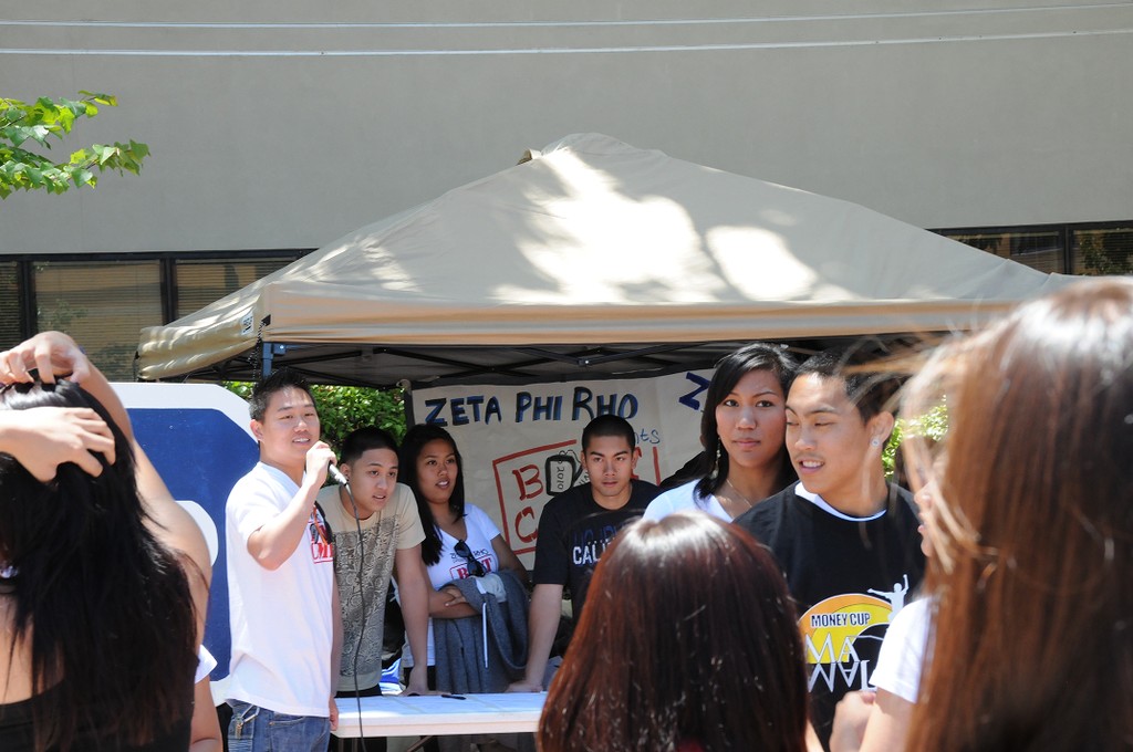 Students participating in competition at Zeta Phi Rho information table ...
